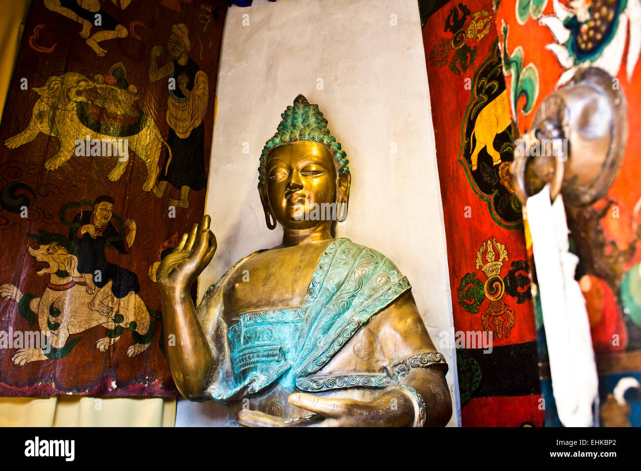 statue of Buddha, with hand raised, in a temple Stock Photo - Alamy