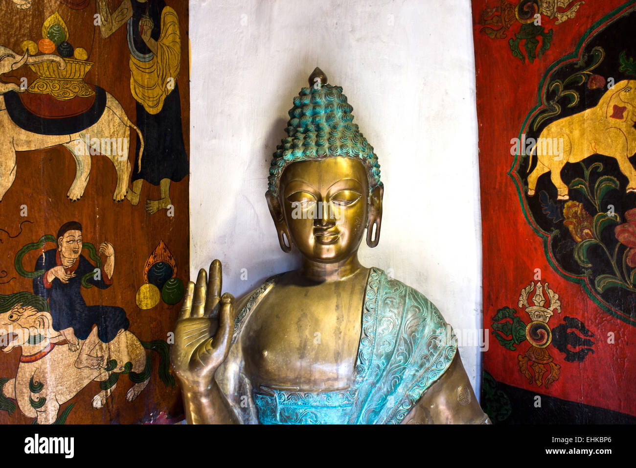 statue of Buddha, with hand raised, in a temple Stock Photo - Alamy