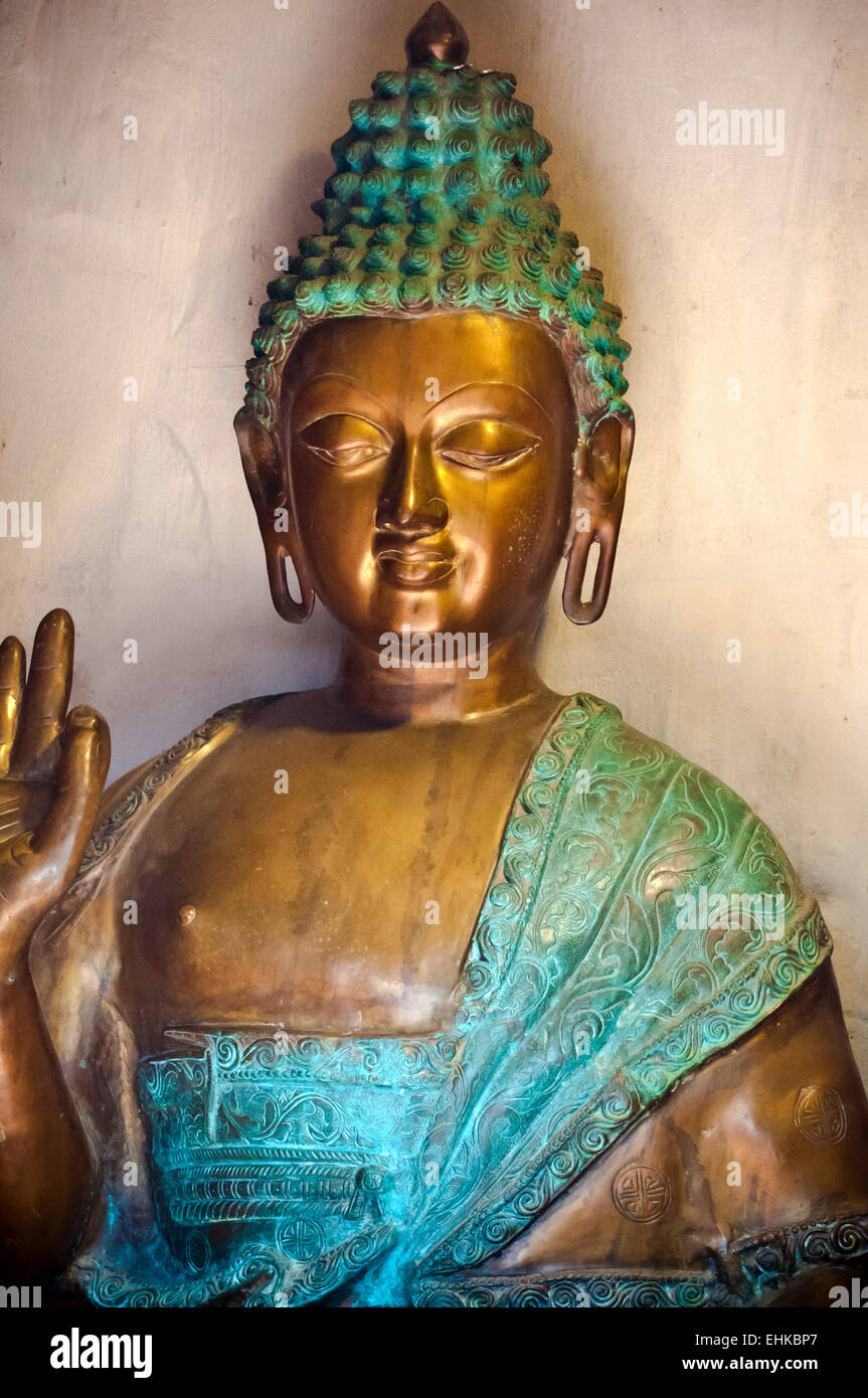 statue of Buddha, with hand raised, in a temple Stock Photo - Alamy