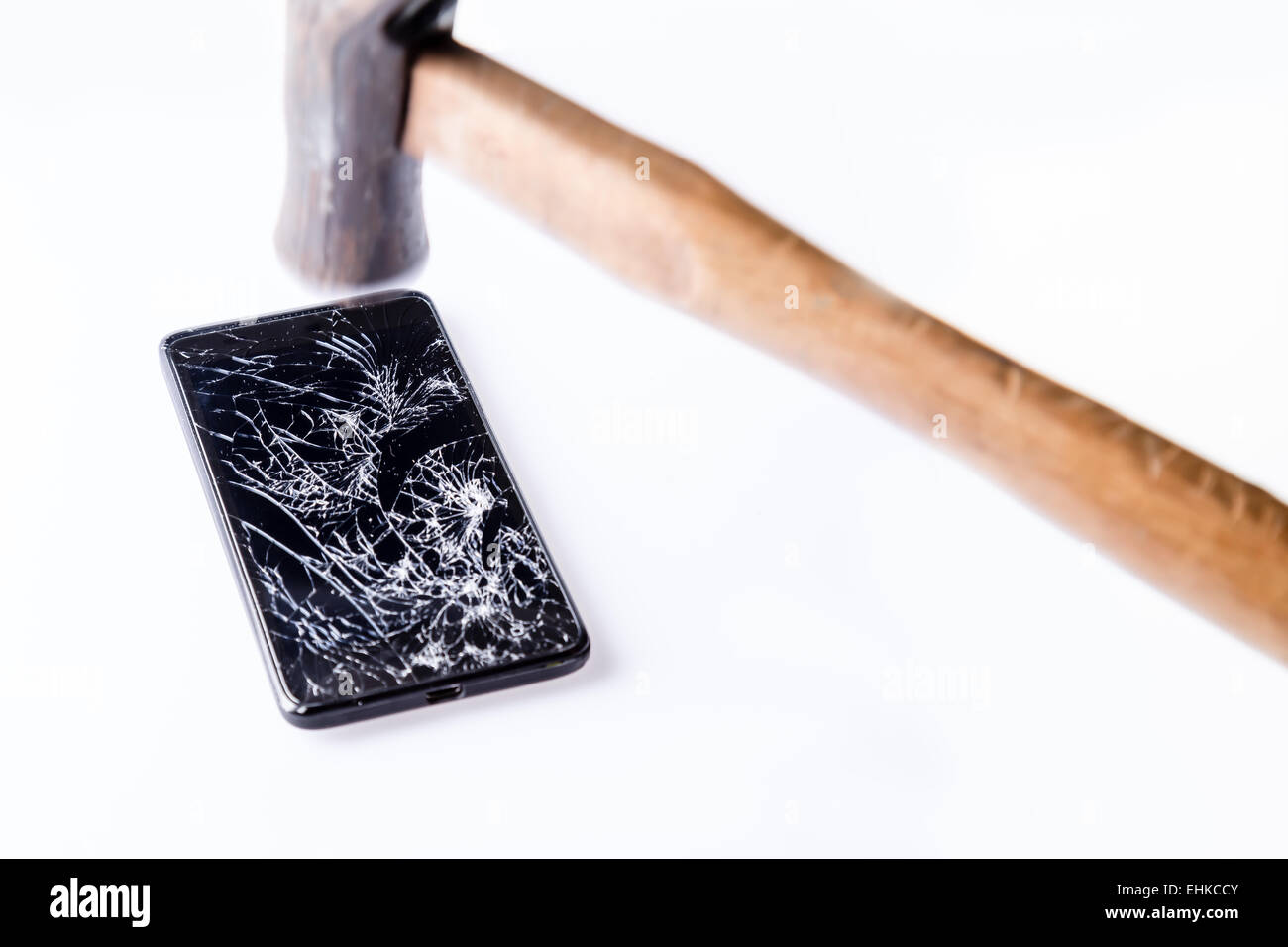 Hammer and smartphone with broken screen isolated on white Stock Photo ...