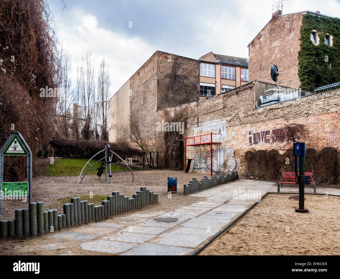 Berlin children's playground surrounded by brick buildings, Kreuzberg ...