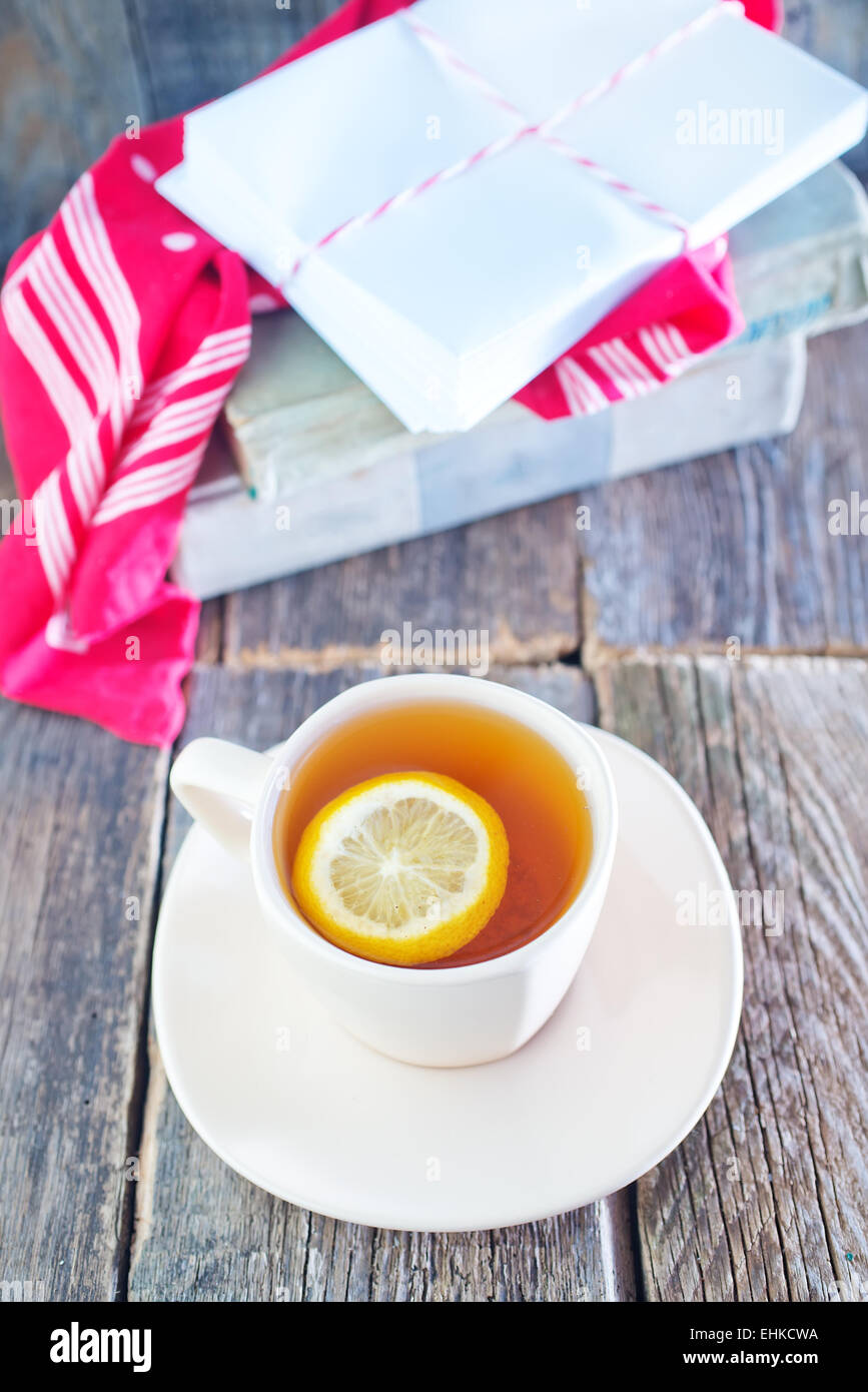 tea with lemon in cup and on a table Stock Photo - Alamy