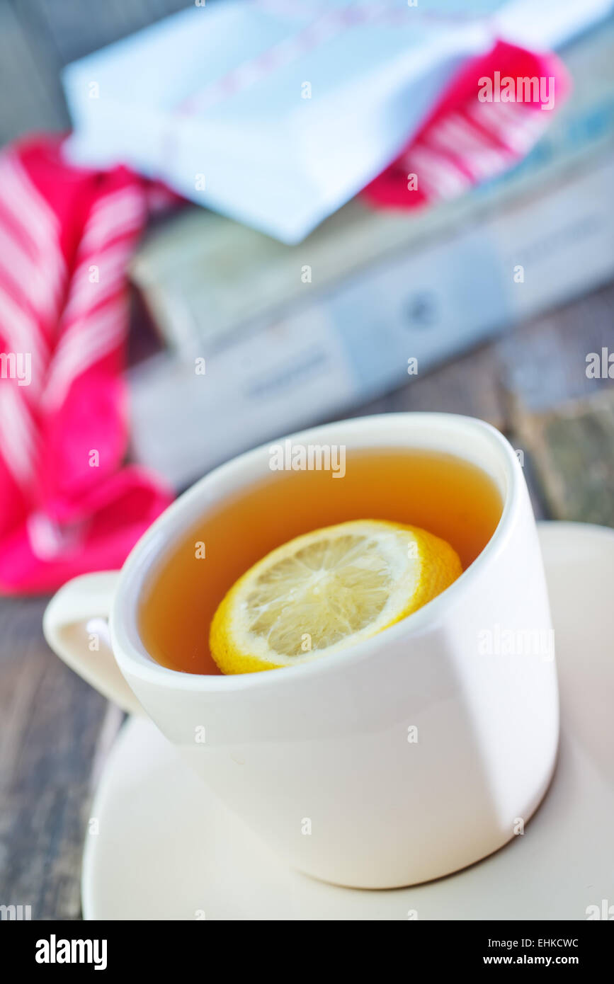 tea with lemon in cup and on a table Stock Photo - Alamy