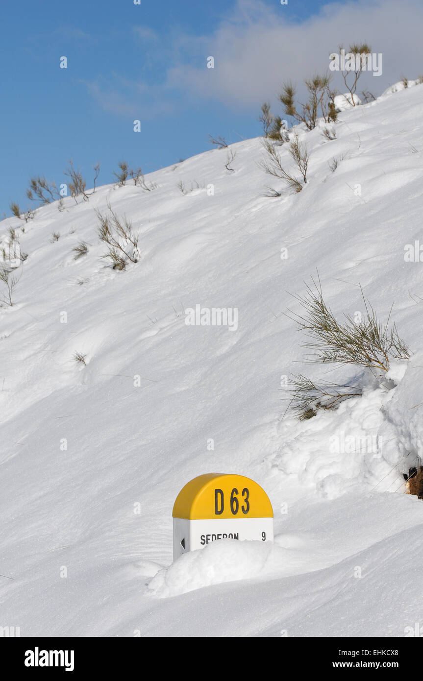 milestone in the snow Stock Photo - Alamy