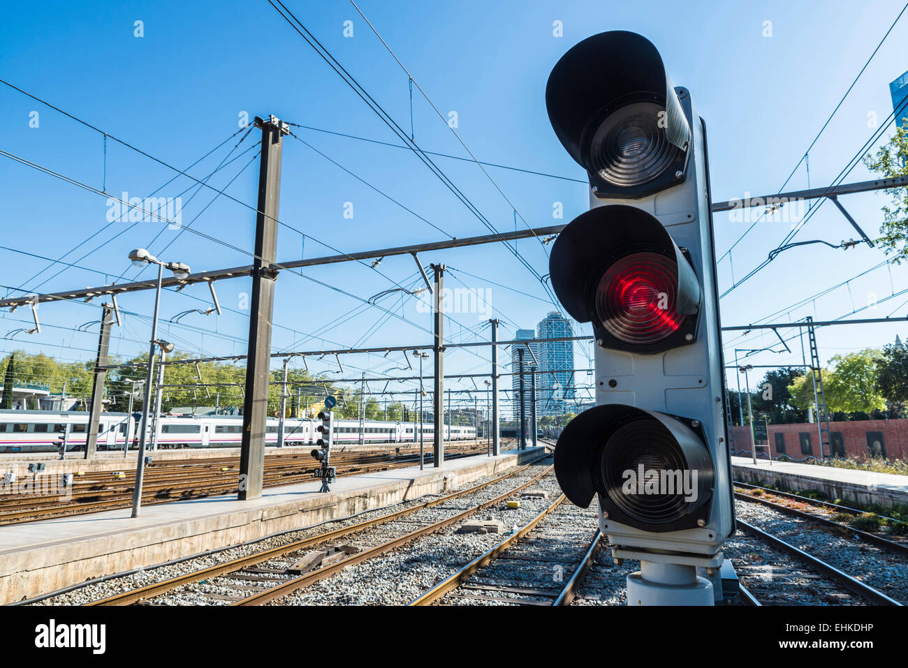 Traffic light shows red signal on railway in station of Barcelona ...