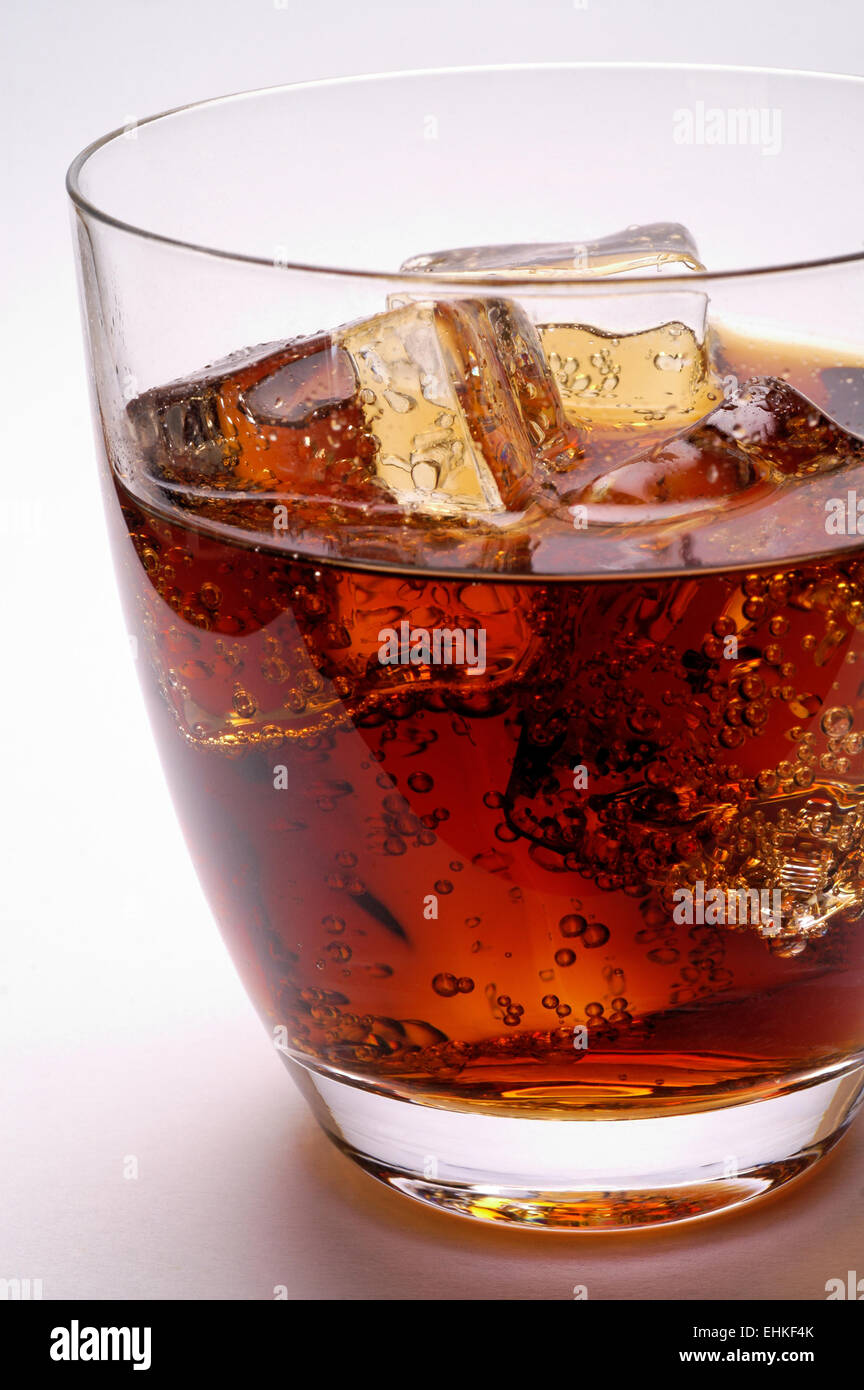 Glass of cola drink with ice Stock Photo - Alamy
