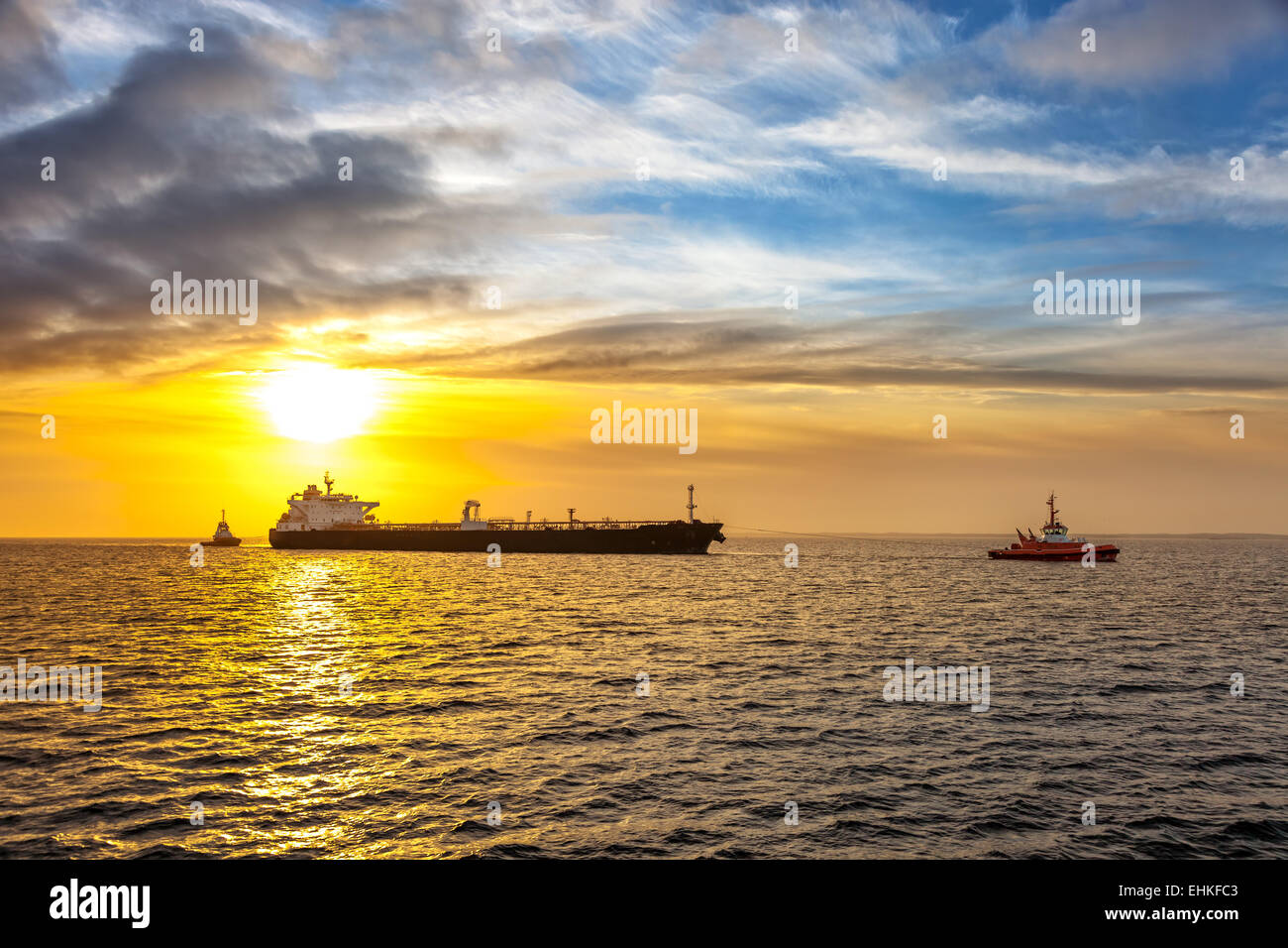 Tugboat pulling the tanker at sea in the morning Stock Photo - Alamy