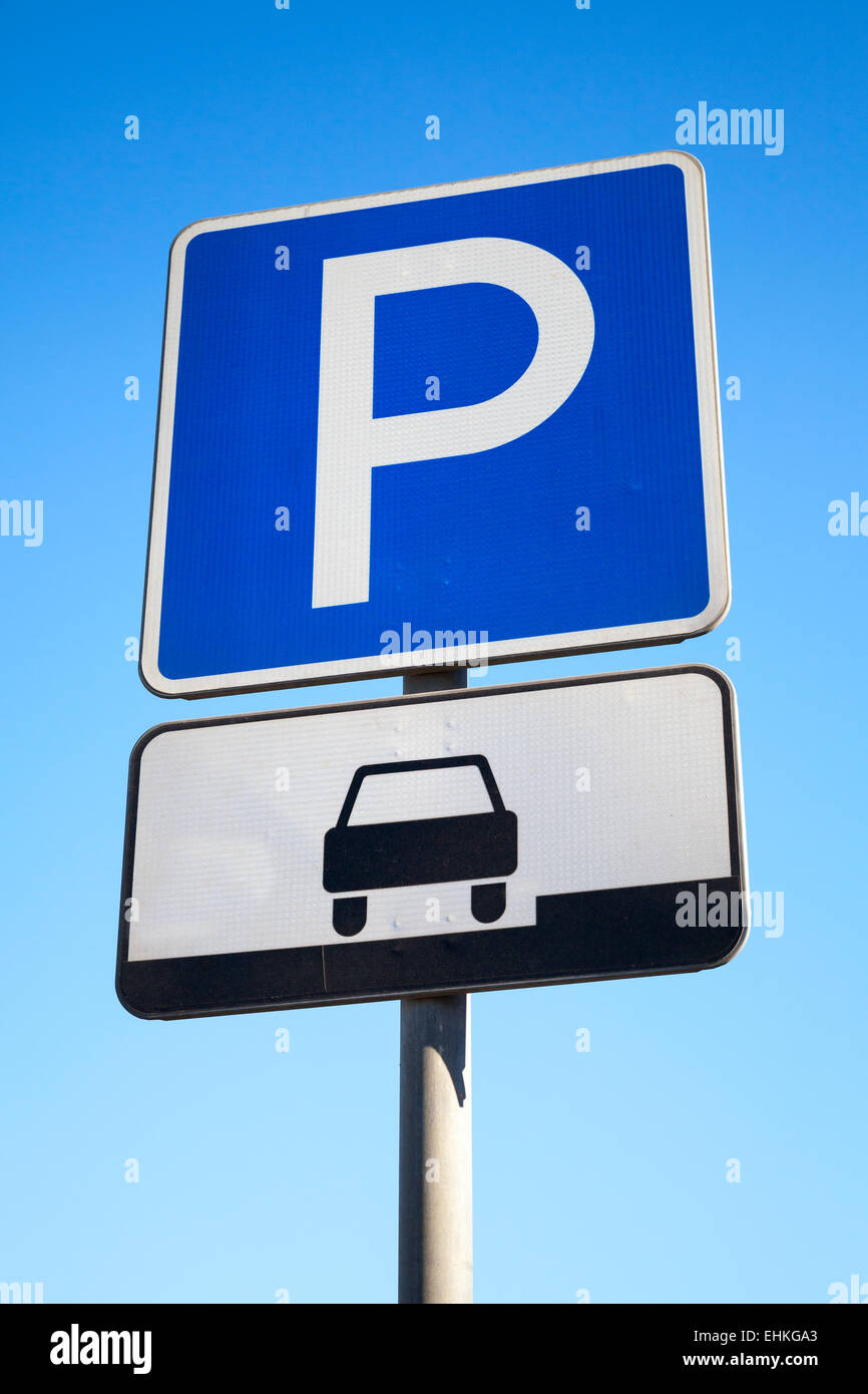 Blue parking road sign on the blue sky background Stock Photo - Alamy