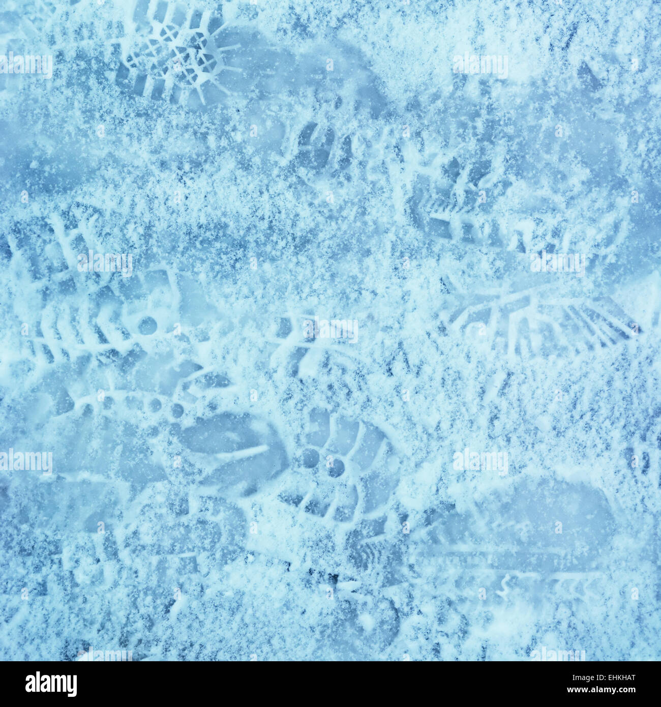 Footsteps on snowy patterned walk way Stock Photo - Alamy