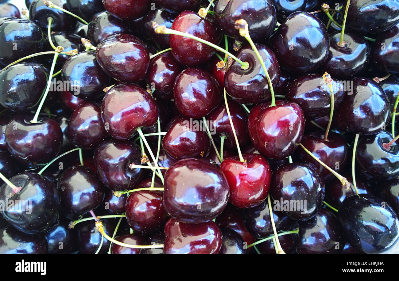 Dark red shiny ripe cherries at the market stall Stock Photo - Alamy