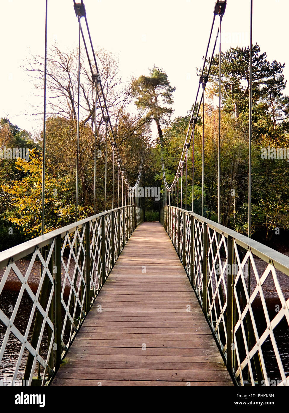 iron suspension bridge footbridge with wood slats over the River Wharfe ...