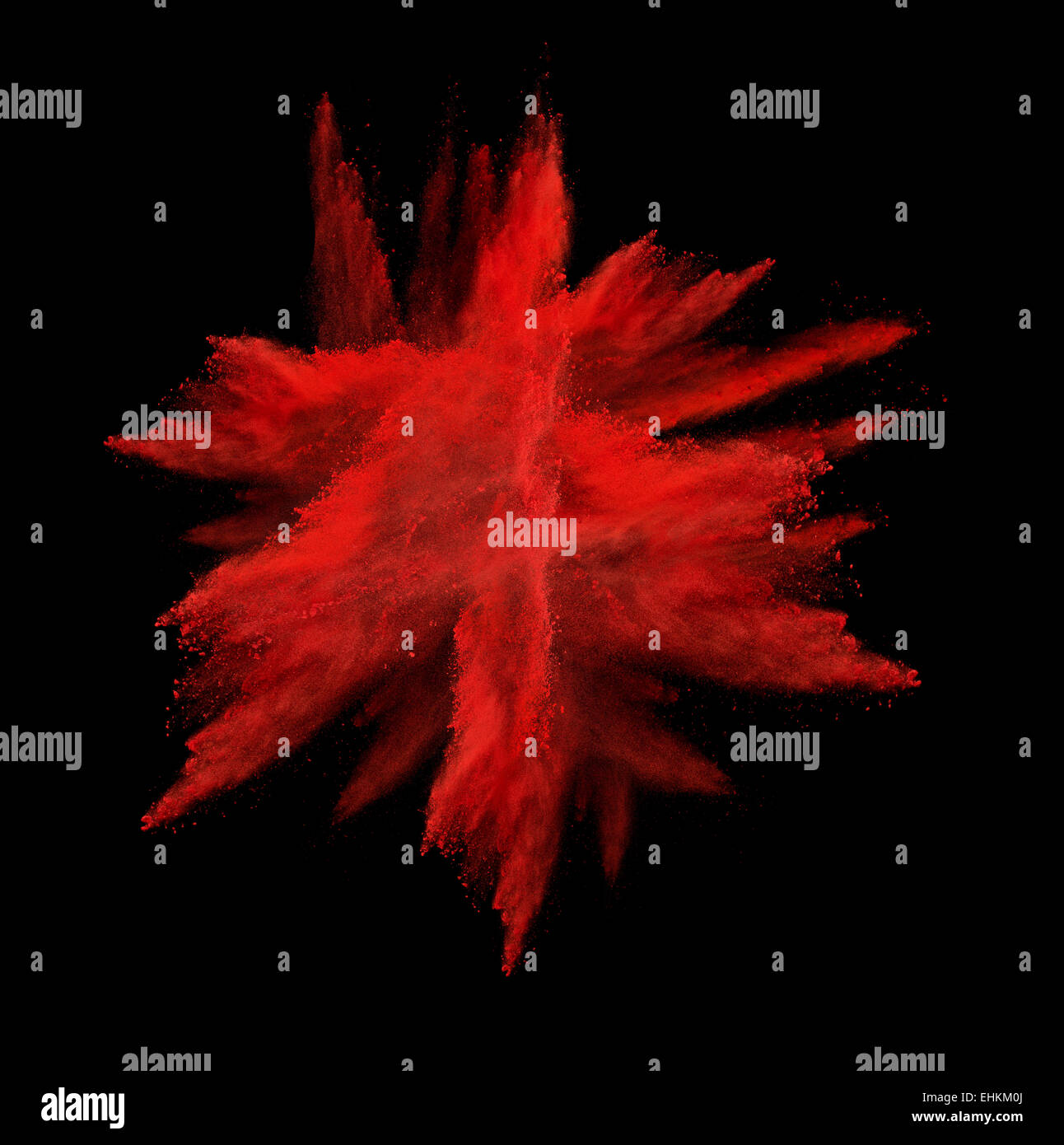 Freeze motion of red dust explosion isolated on black background Stock ...