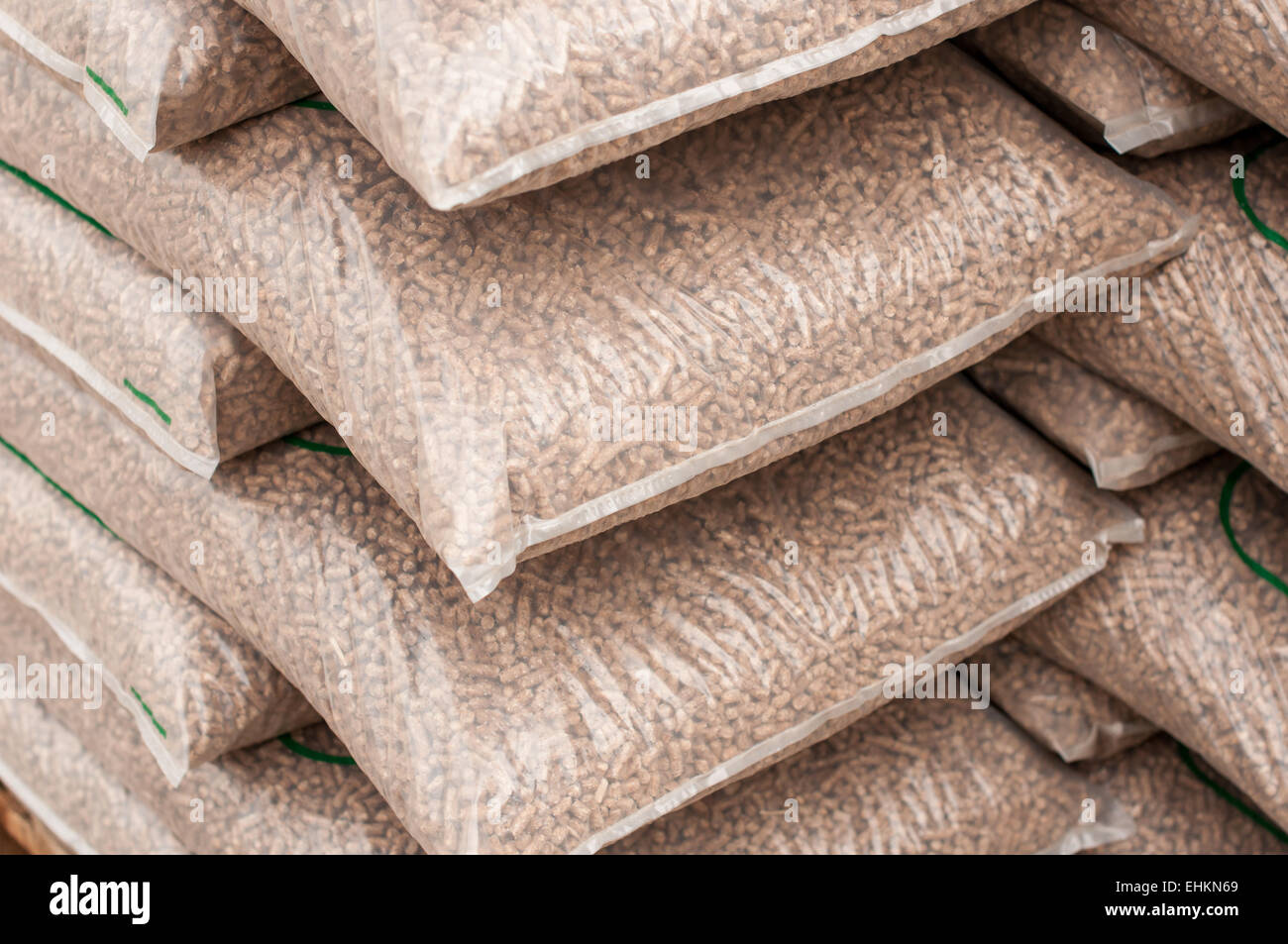 Pile of sacks of pellets, which are stacked on pallets Stock Photo - Alamy