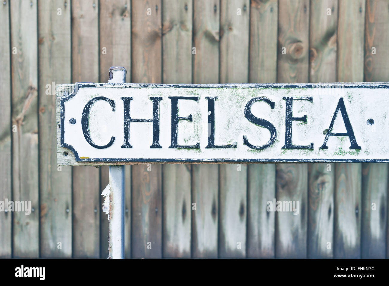 Chelsea road sign in front of a wooden fence Stock Photo - Alamy