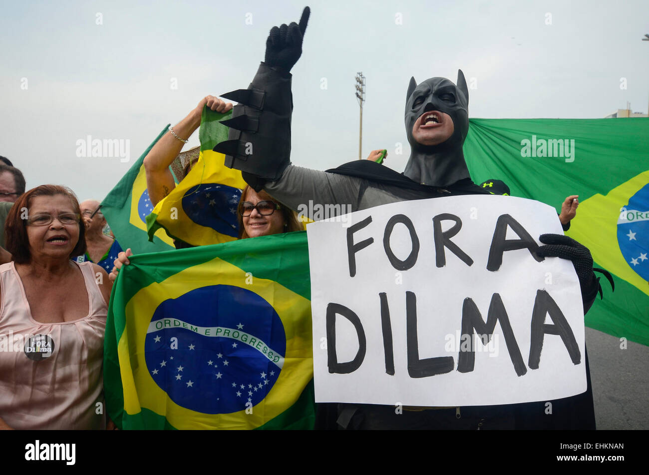 Rio De Janeiro, Brazil. 15th Mar, 2015. A demonstrator holds a sign ...