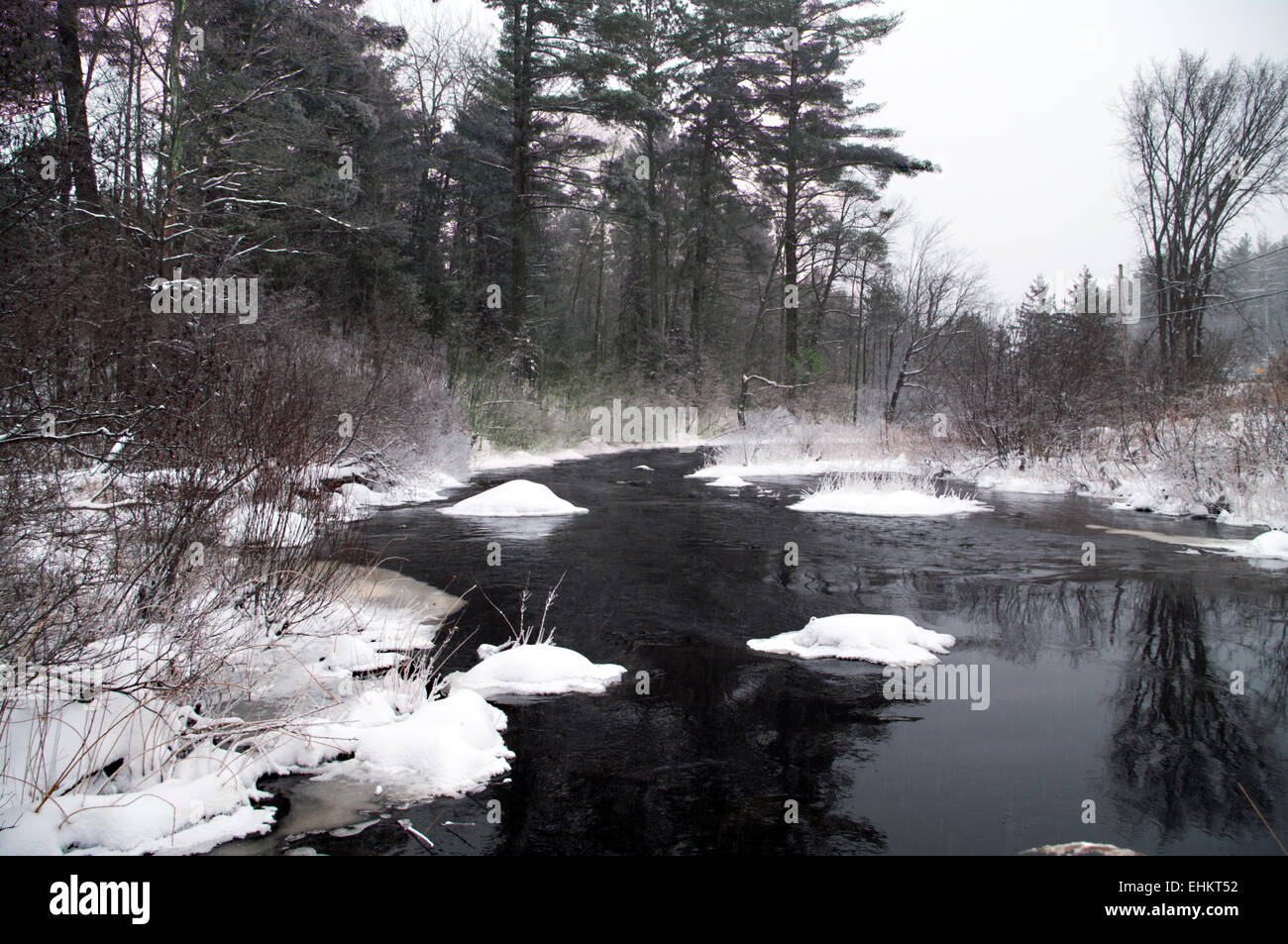 Winter stream flowing open in extreme cold with frost Stock Photo - Alamy