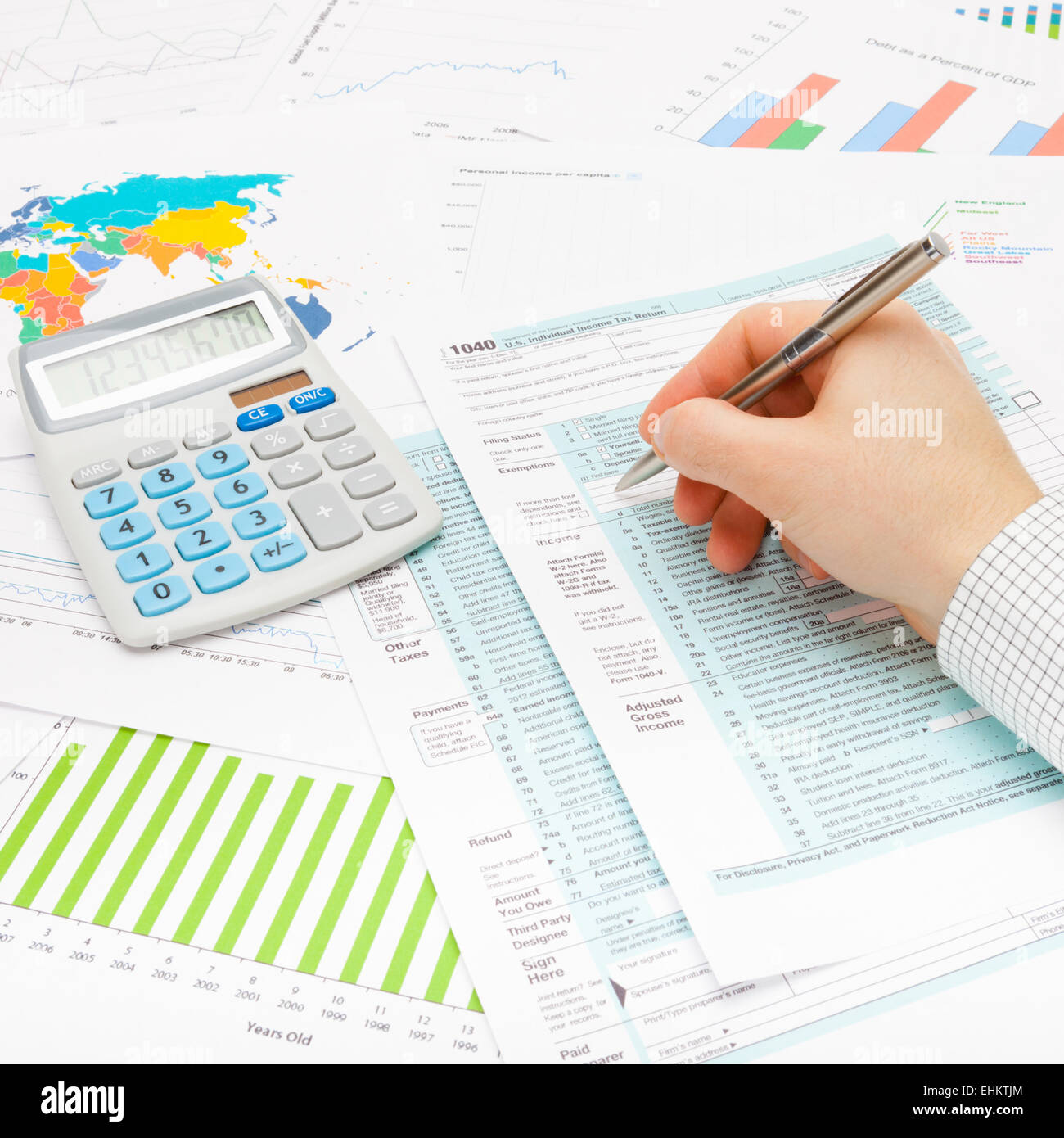 Male filling out 1040 US Tax Form with ball pen - studio shot Stock ...