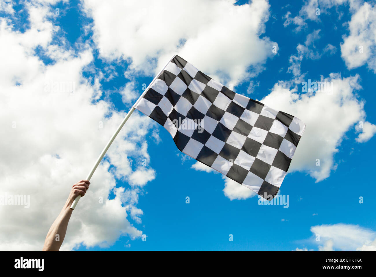 Checkered flag waving in the wind - outdoors shoot Stock Photo - Alamy