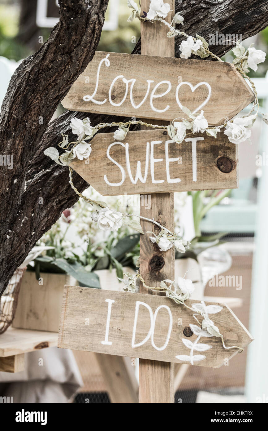 Wooden sign saying love, sweet and i do Stock Photo - Alamy