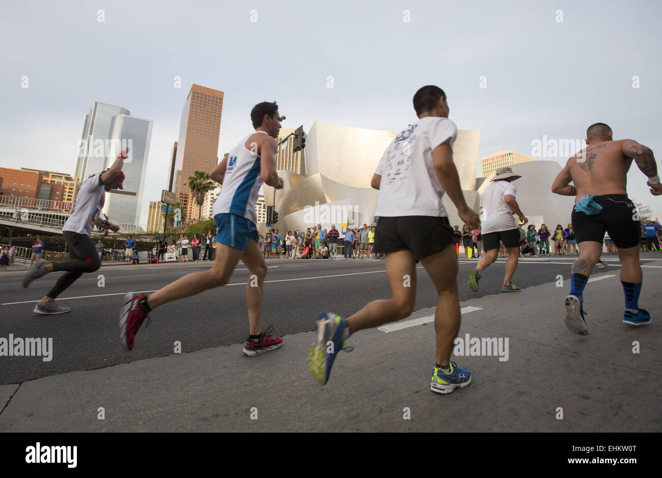 Los Angeles, California, USA. 15th Mar, 2015. Runners make their way by ...