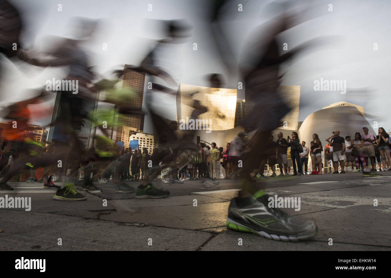 Los Angeles, California, USA. 15th Mar, 2015. Runners make their way by ...
