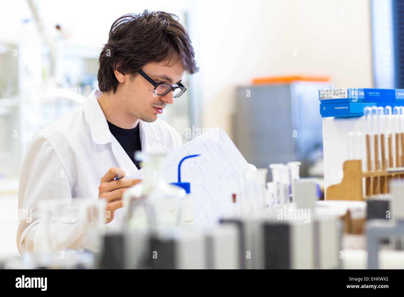 Male researcher carrying out scientific research in a lab (shallow DOF ...
