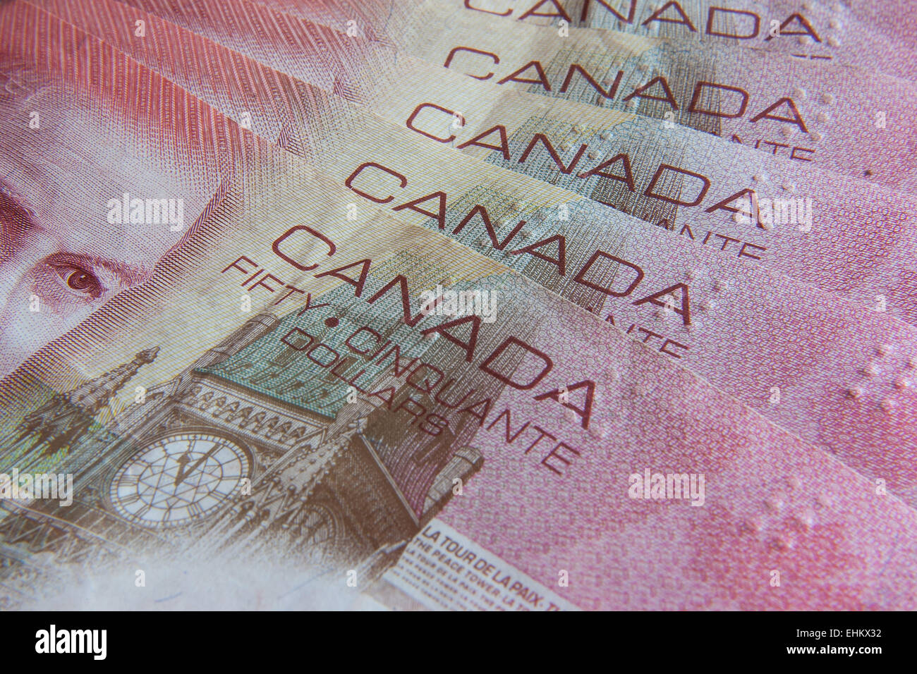 Canadian banknotes of the same value on the desk Stock Photo - Alamy