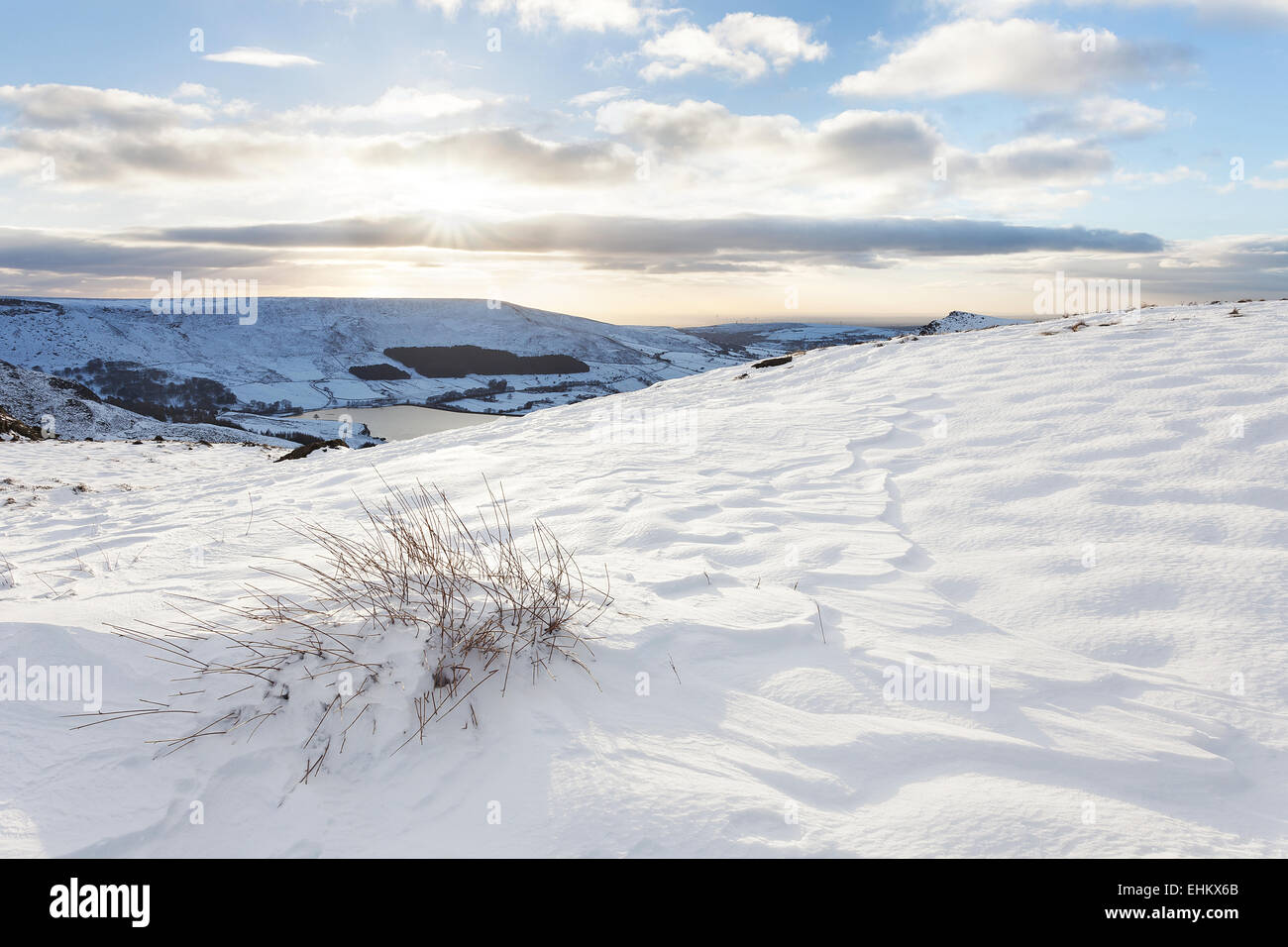 Sunset behind snow drifts and grass on Saddleworth Moor - looking out ...