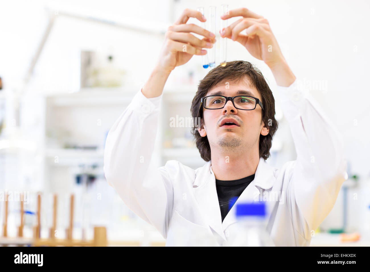 Male researcher carrying out scientific research in a lab (shallow DOF ...