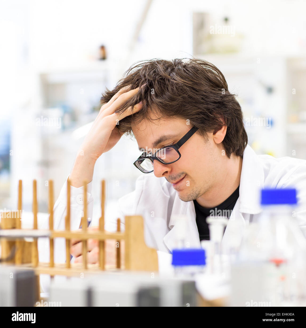 Male researcher carrying out scientific research in a lab (shallow DOF ...