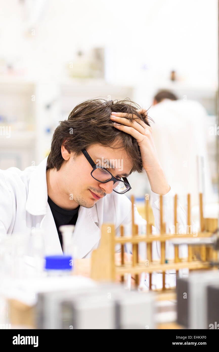 Male researcher carrying out scientific research in a lab (shallow DOF ...