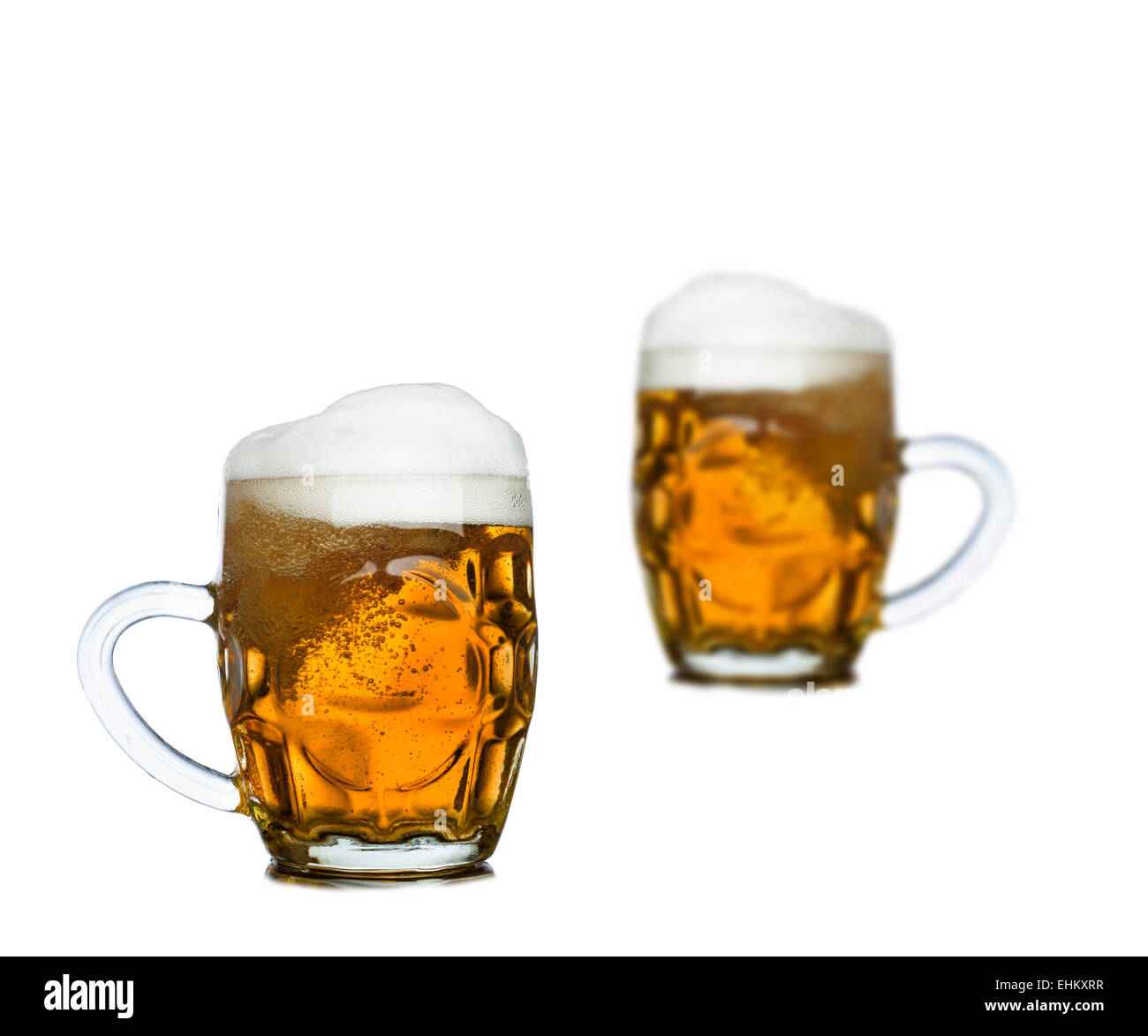 Mugs full of fresh beer isolated on white Stock Photo - Alamy