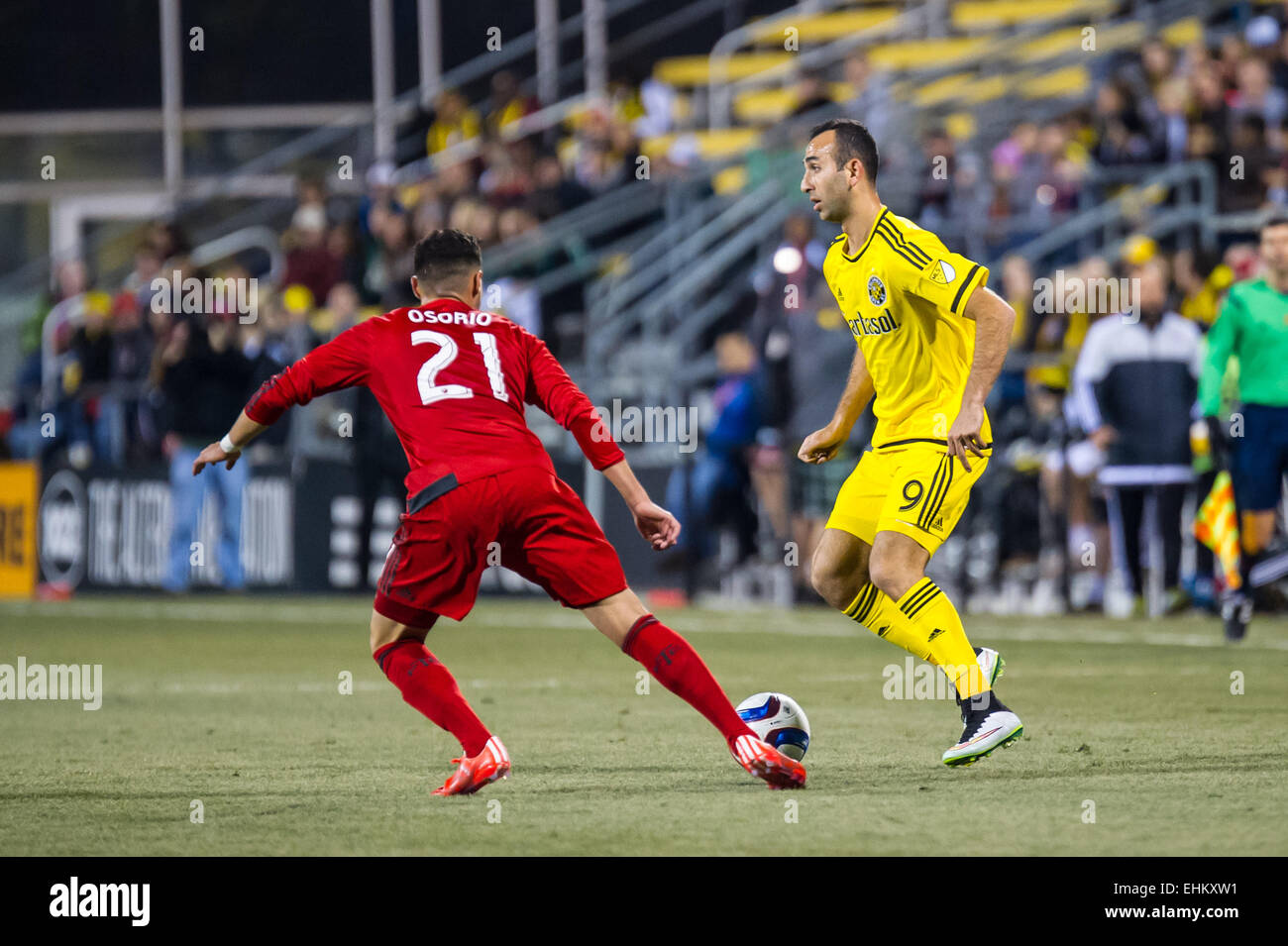 Columbus Crew SC forward Justin Meram (9) with Toronto FC midfielder ...