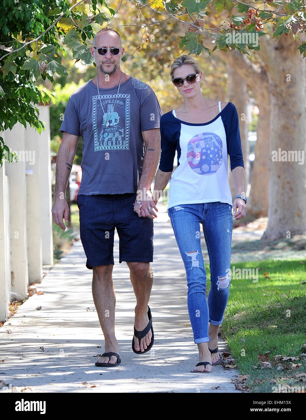 Actress Brooke Burns holds on tight to fiance Gavin O'Connor as the ...