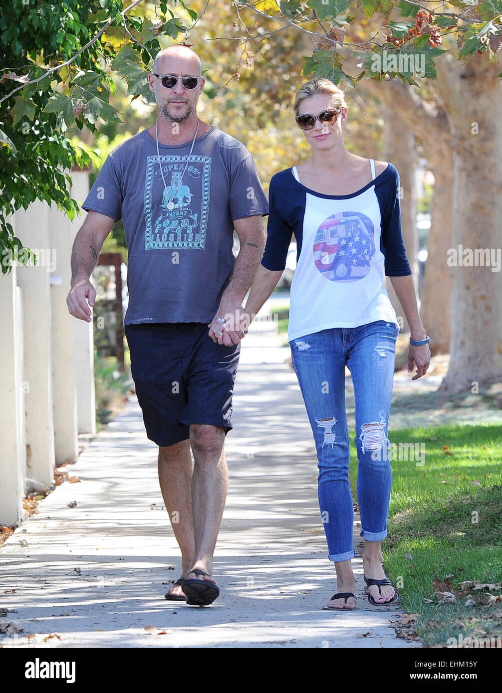 Actress Brooke Burns holds on tight to fiance Gavin O'Connor as the ...