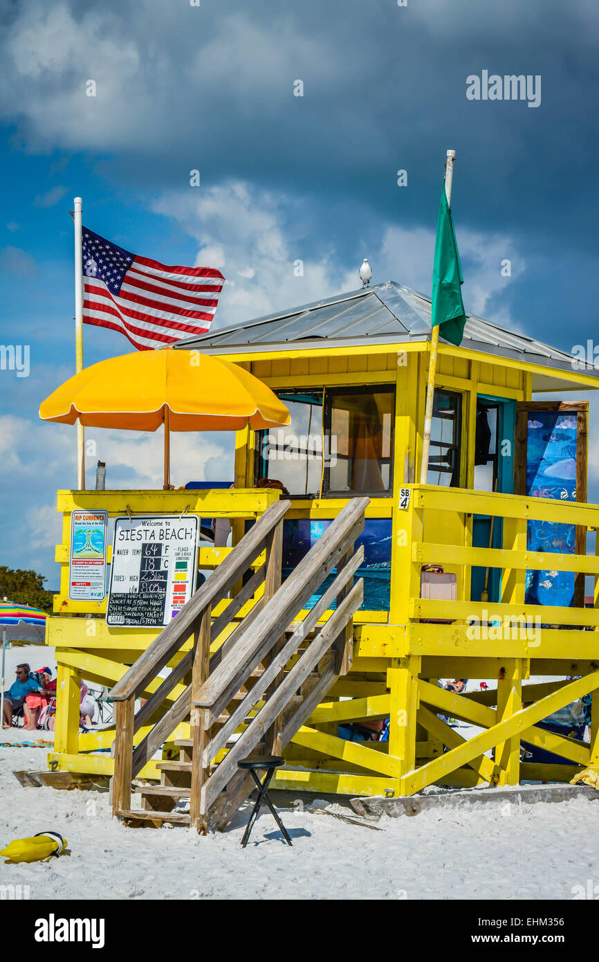 A colorful life guard stand at Siesta Key Beach on a warm and cloudy ...