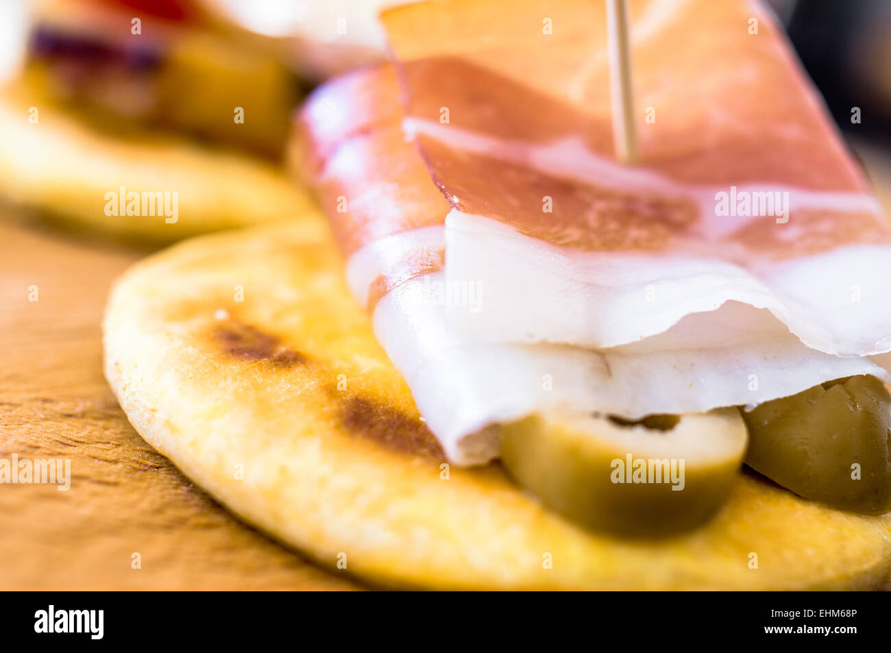 Tapas with bacon and potatoes, olives and tomatoes Stock Photo - Alamy
