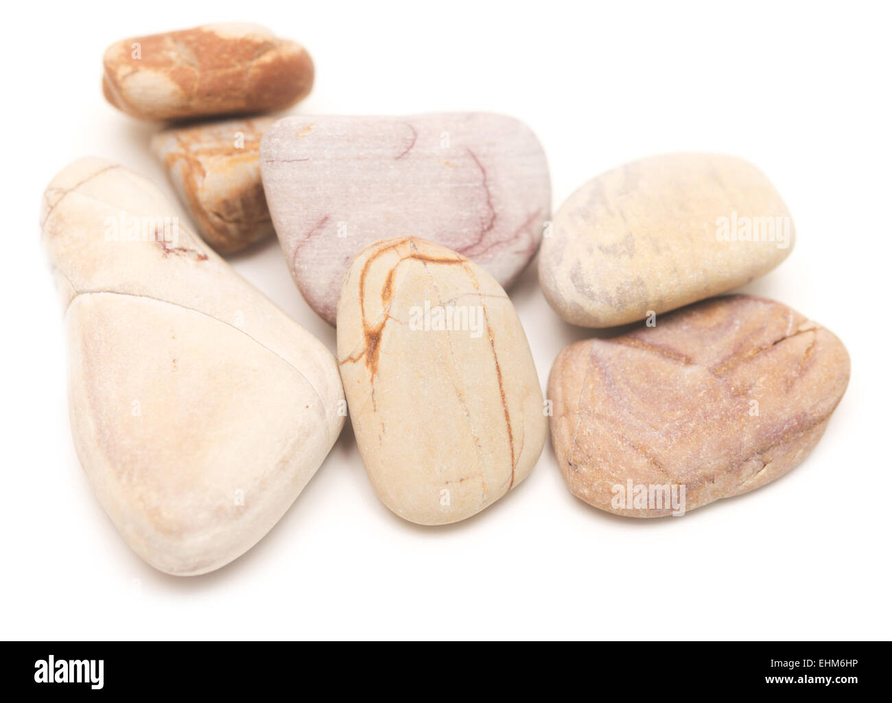 pile of sea smooth stones isolated on white Stock Photo - Alamy