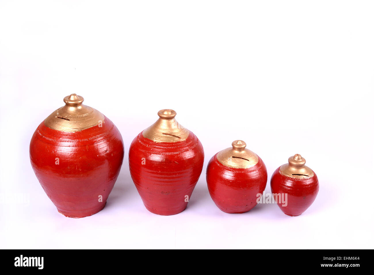 Earthen pot is a coin box of rural India called Gullak, in row Stock ...