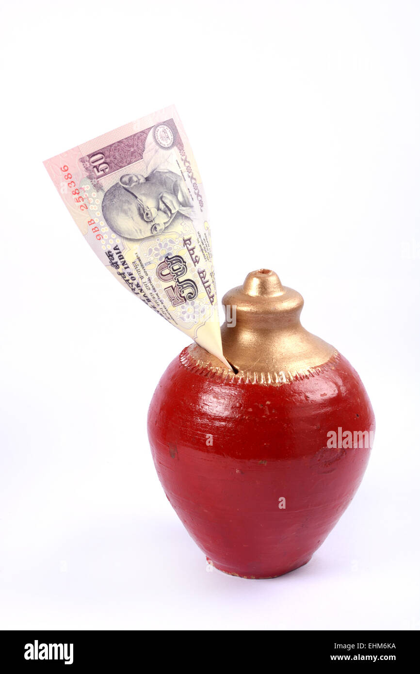 Earthen pot is a coin box of rural India called Gullak, with fifty ...