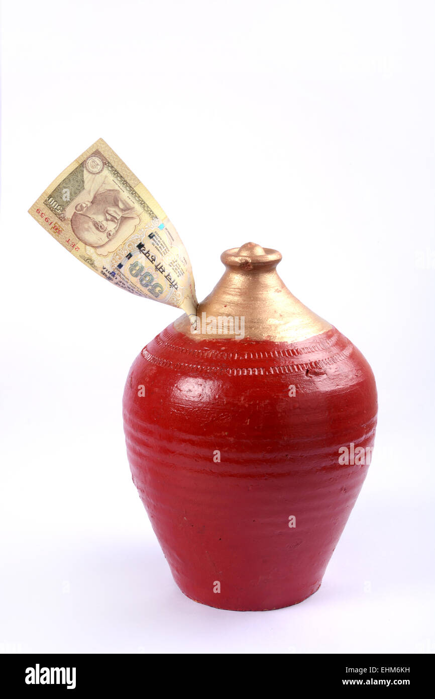 Earthen pot is a coin box of rural India called Gullak, with five ...