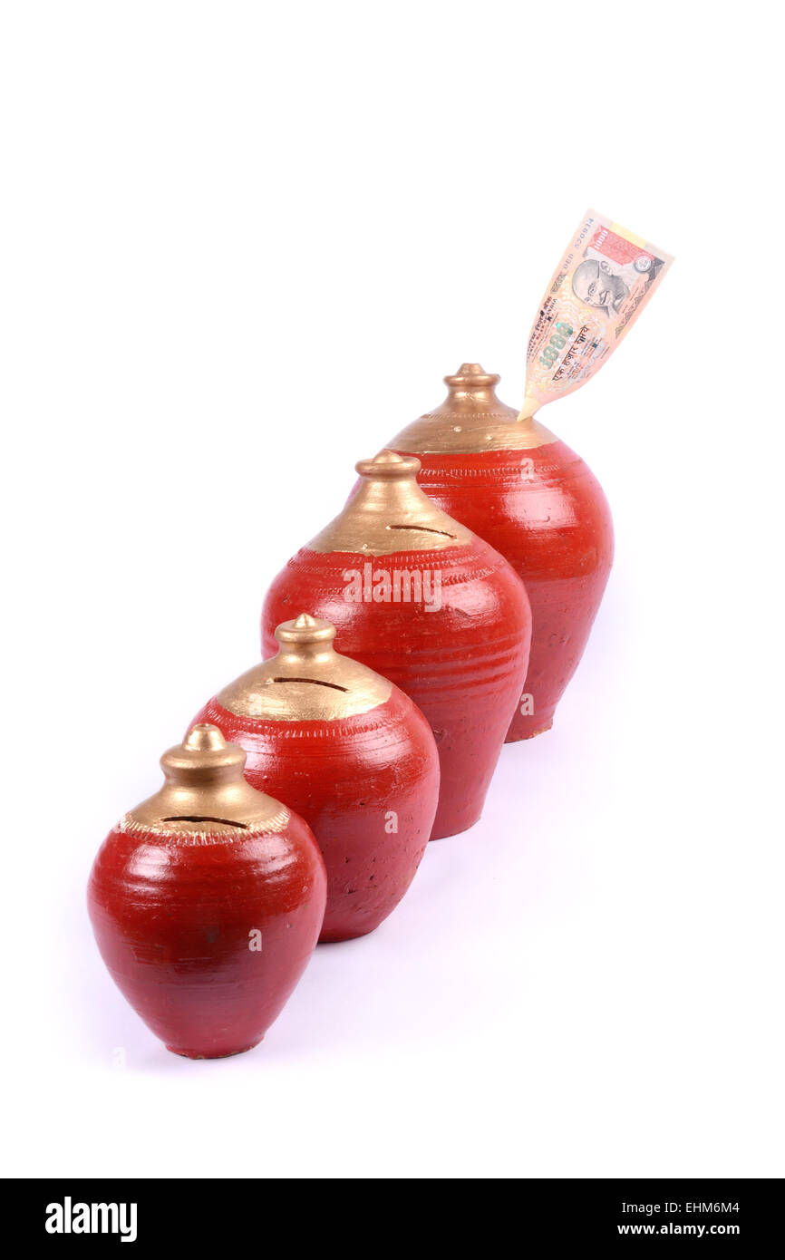 Earthen pot is a coin box of rural India called Gullak, with one ...