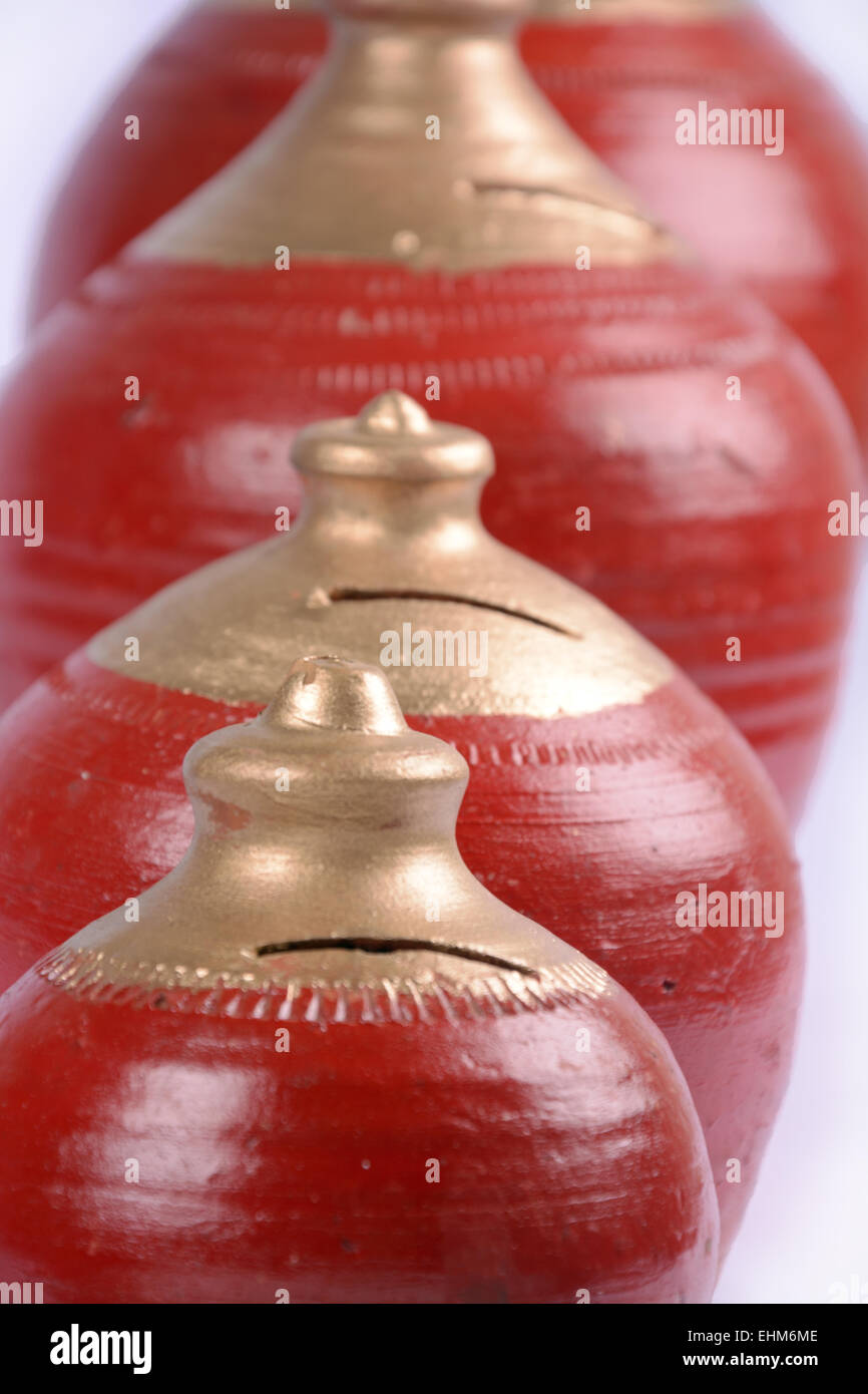 Earthen pot is a coin box of rural India called Gullak Stock Photo - Alamy