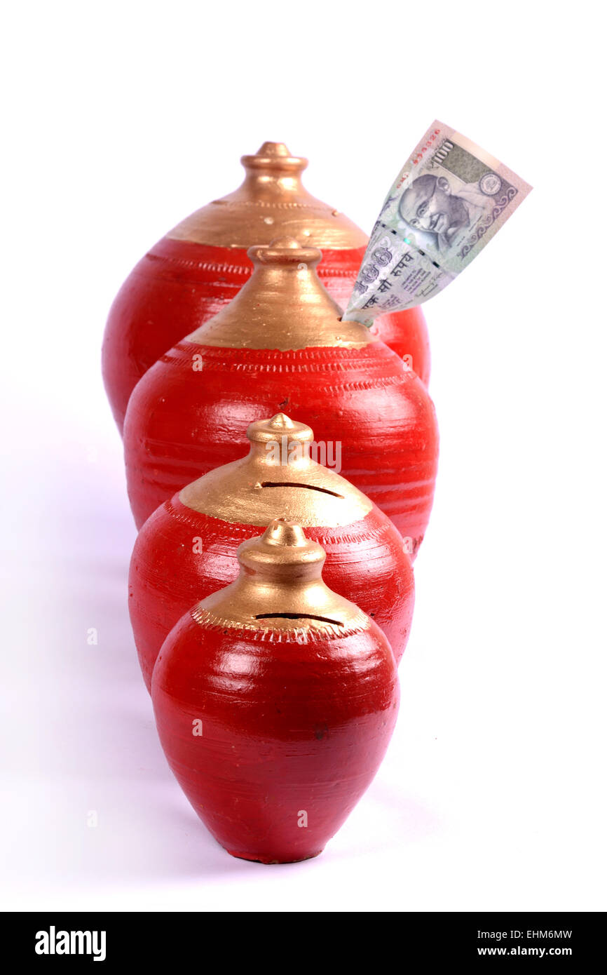 Indian rupees with a piggy bank Cut Out Stock Images & Pictures - Alamy