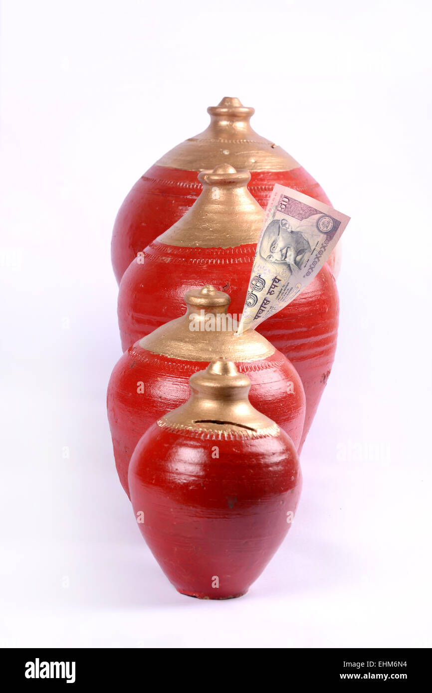 Earthen pot is a coin box of rural India called Gullak Stock Photo - Alamy