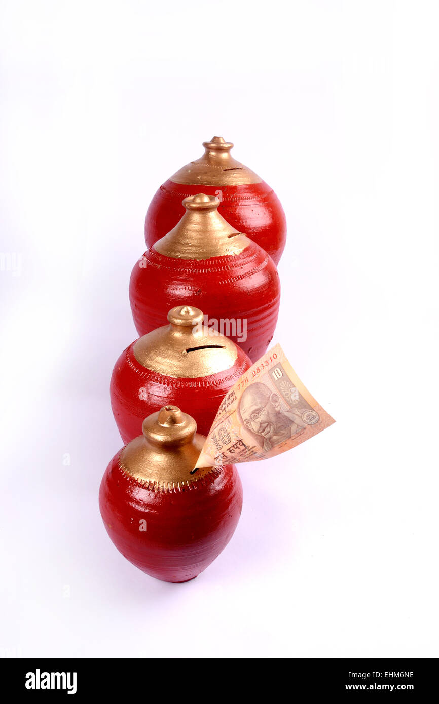 Earthen pot is a coin box of rural India called Gullak Stock Photo - Alamy
