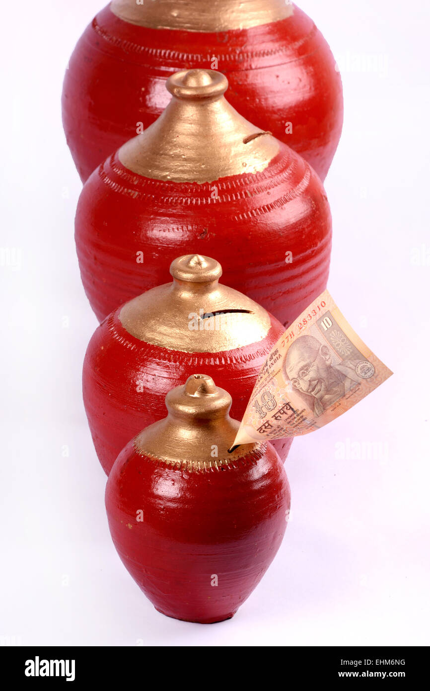 Earthen pot is a coin box of rural India called Gullak Stock Photo - Alamy