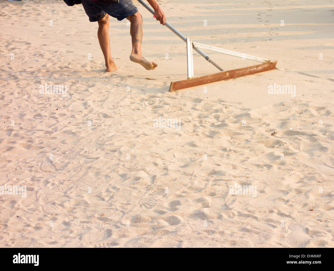 street worker at the beach Stock Photo - Alamy