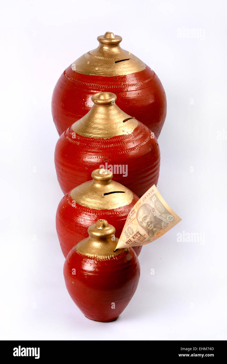 Earthen pot is a coin box of rural India called Gullak Stock Photo - Alamy