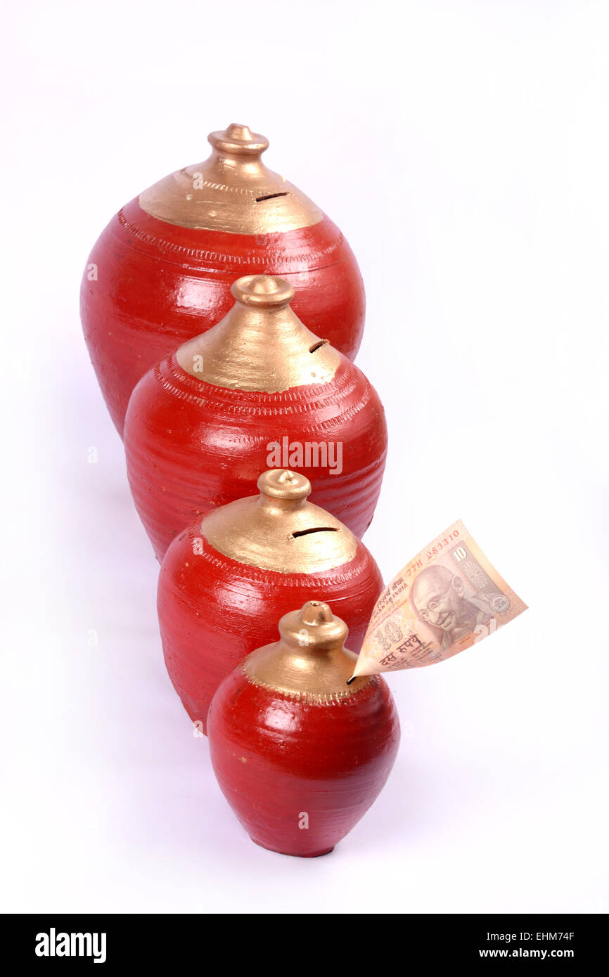 Earthen pot is a coin box of rural India called Gullak Stock Photo - Alamy